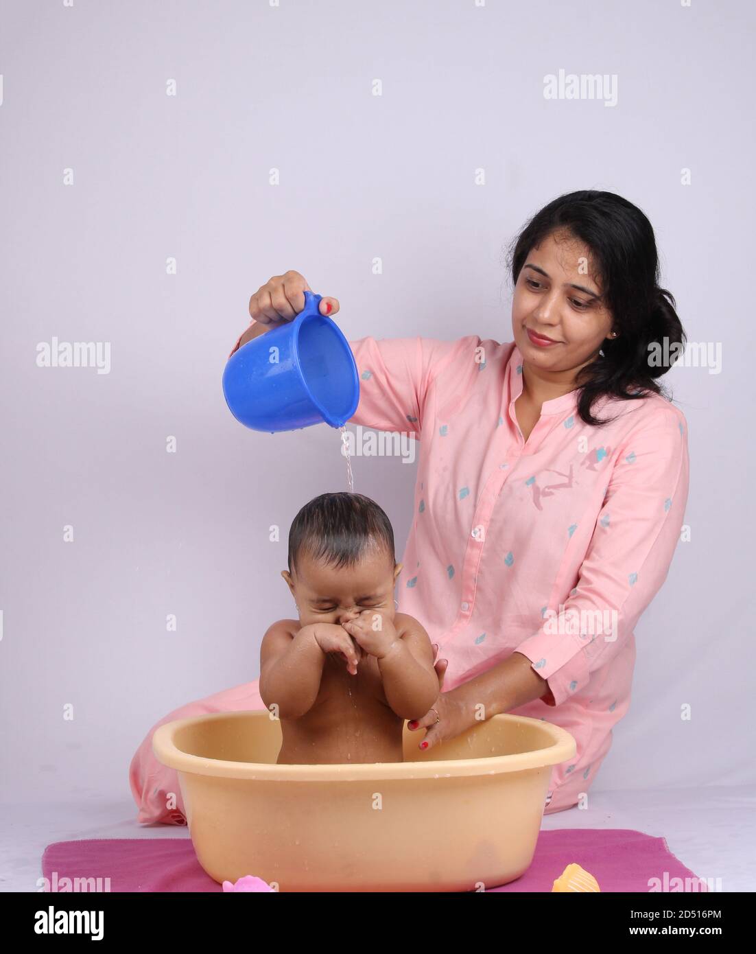 Indian Mother Washing Baby High Resolution Stock Photography and Images ...