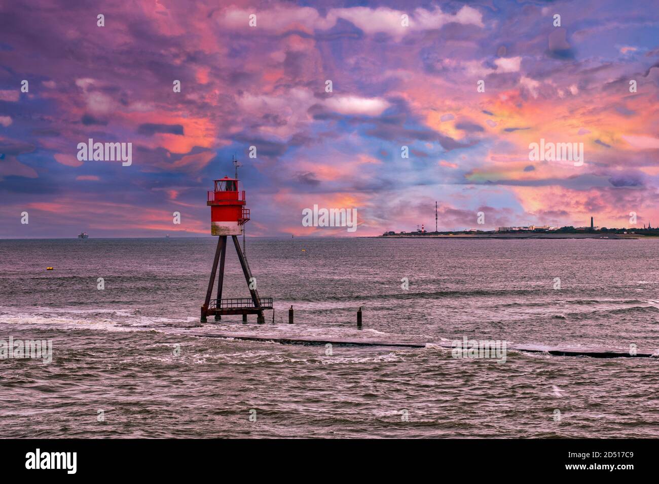 Watchtower at the sea under the colorful clouds Stock Photo - Alamy