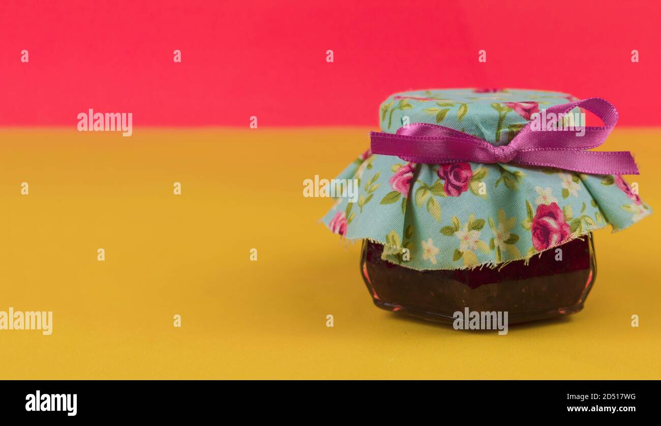 Jelly in on pot isolated on colored background. Fresh colors pastel ...