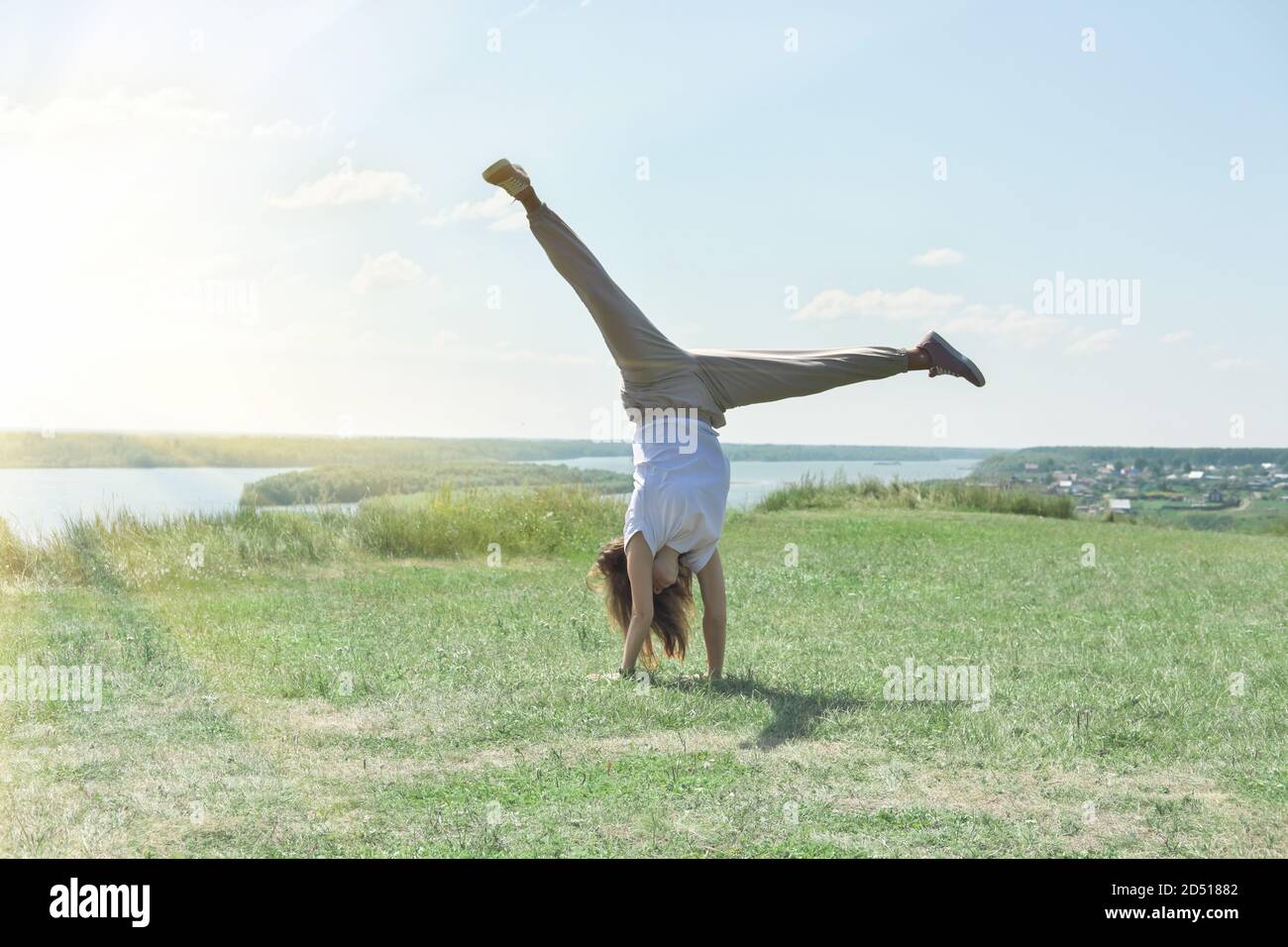 Woman turning cartwheel hi-res stock photography and images - Alamy
