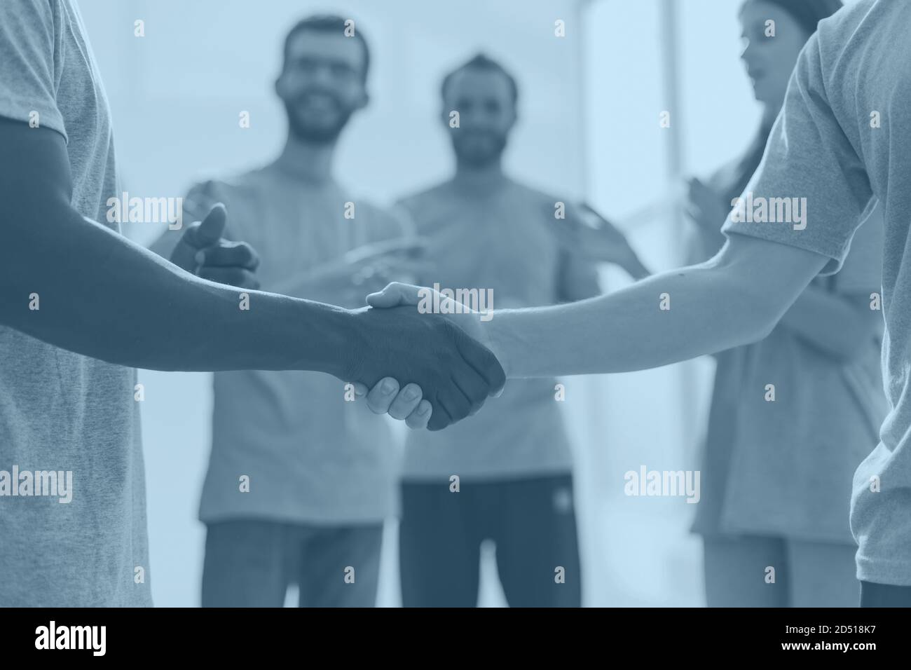 close up. strong handshake of two students of different nationalities ...