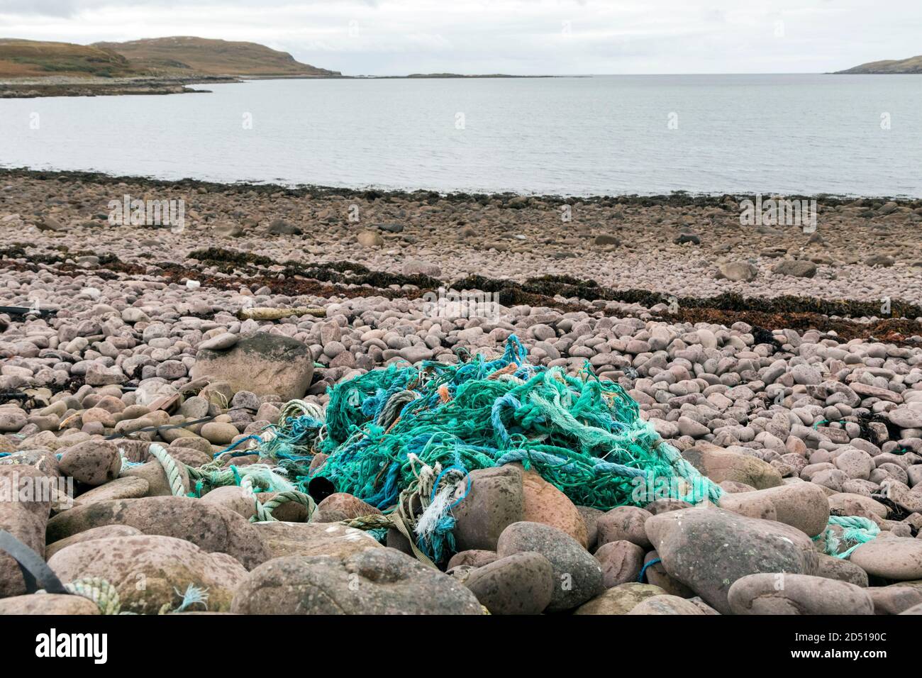 A Tangle of Plastic Rope and Fishing Nets Washed up on the Beach Near ...