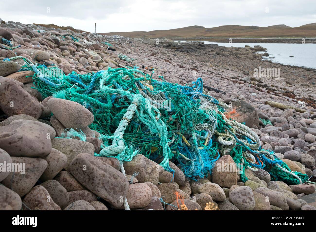 A Tangle of Plastic Rope and Fishing Nets Washed up on the Beach Near ...