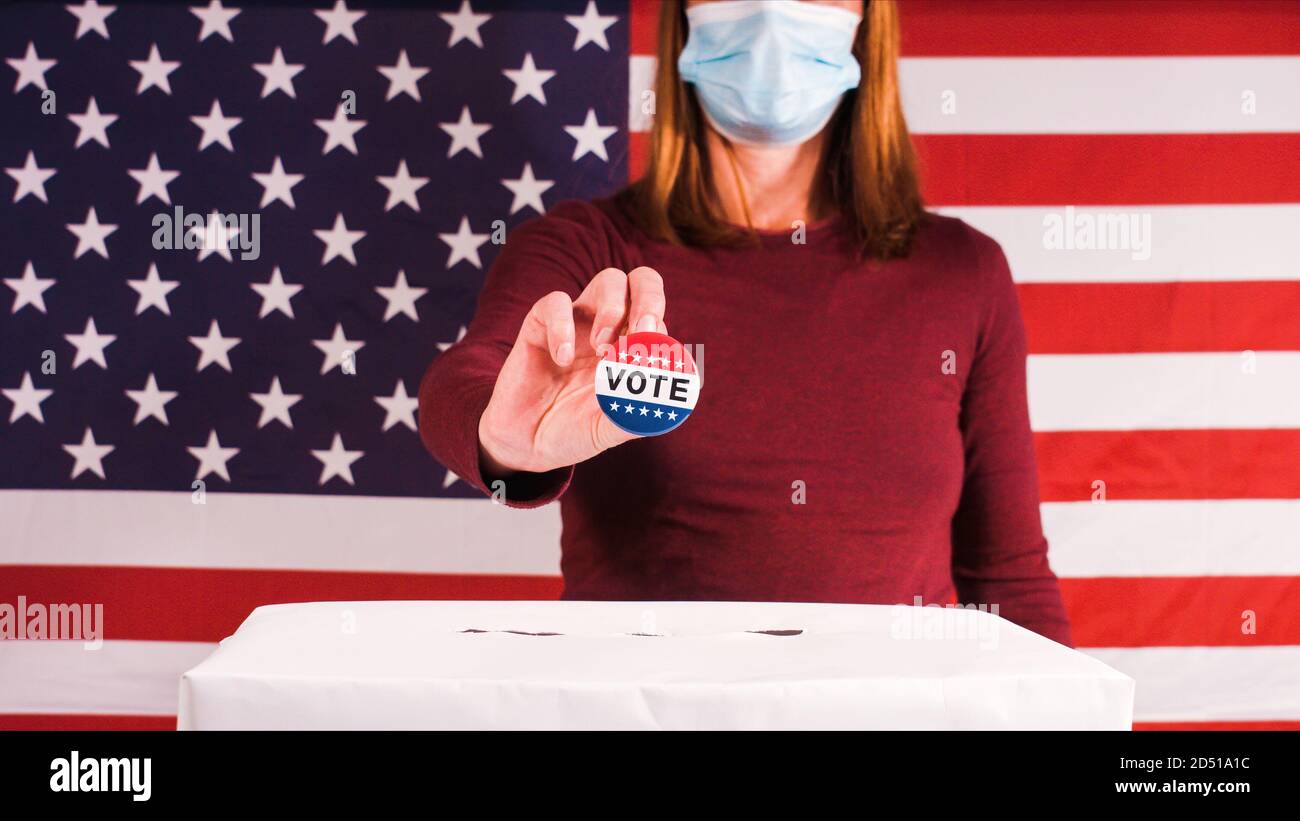 Voting woman showing Vote button with ballot box and american flag ...