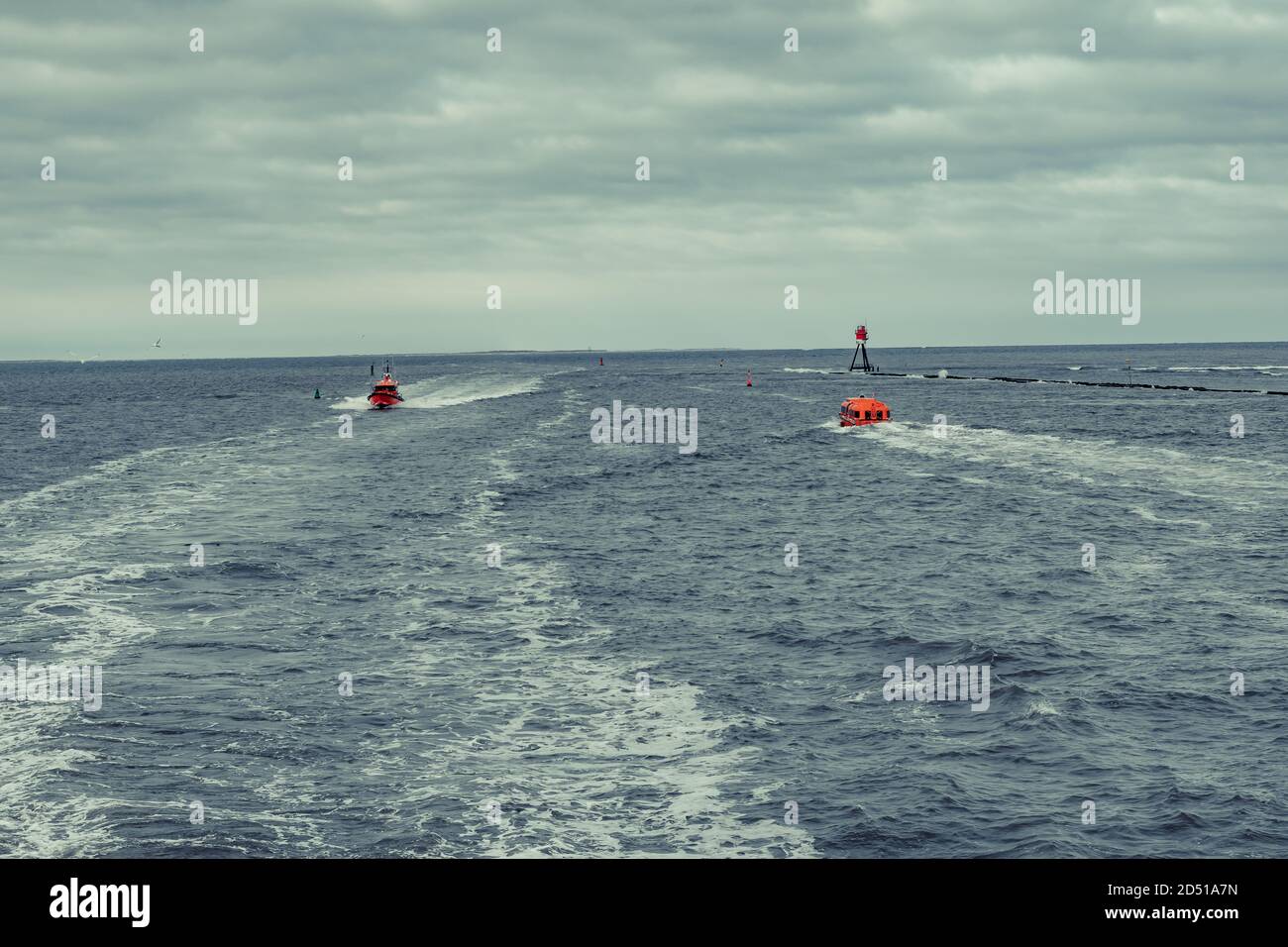 Modern boats on the sea under a cloudy sky on a gloomy day Stock Photo ...
