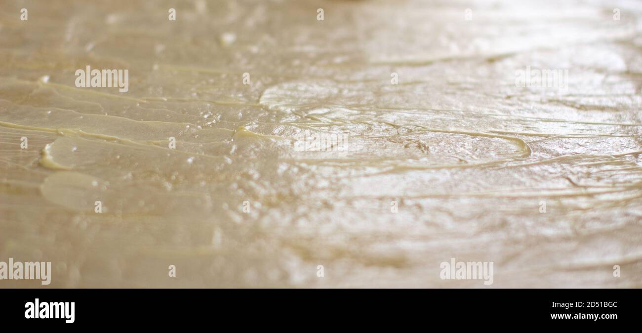 Rolled out and spread with butter and butter for baking Stock Photo - Alamy