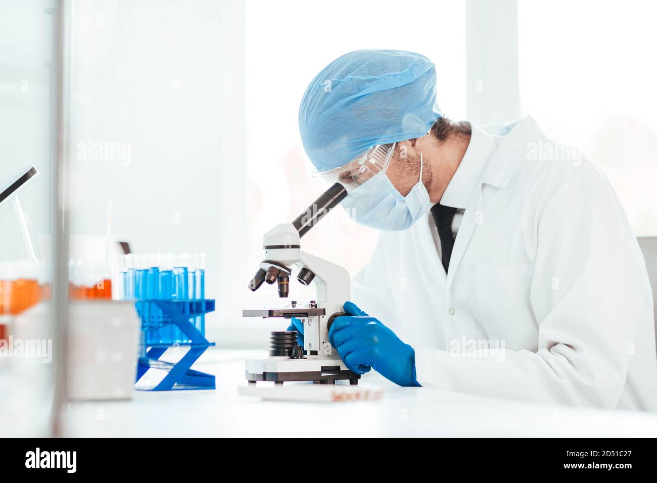 close up. scientist looking into the eyepiece of a microscope Stock ...