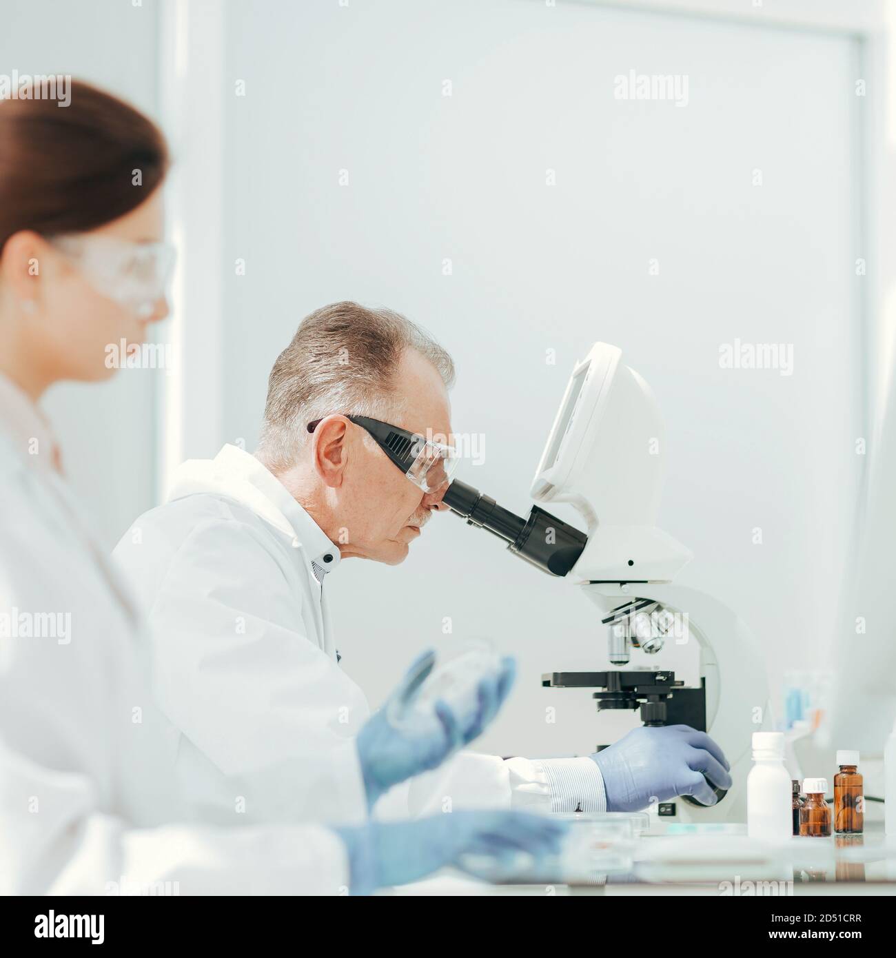 pharmacists from all over using microscope in the laboratory Stock ...