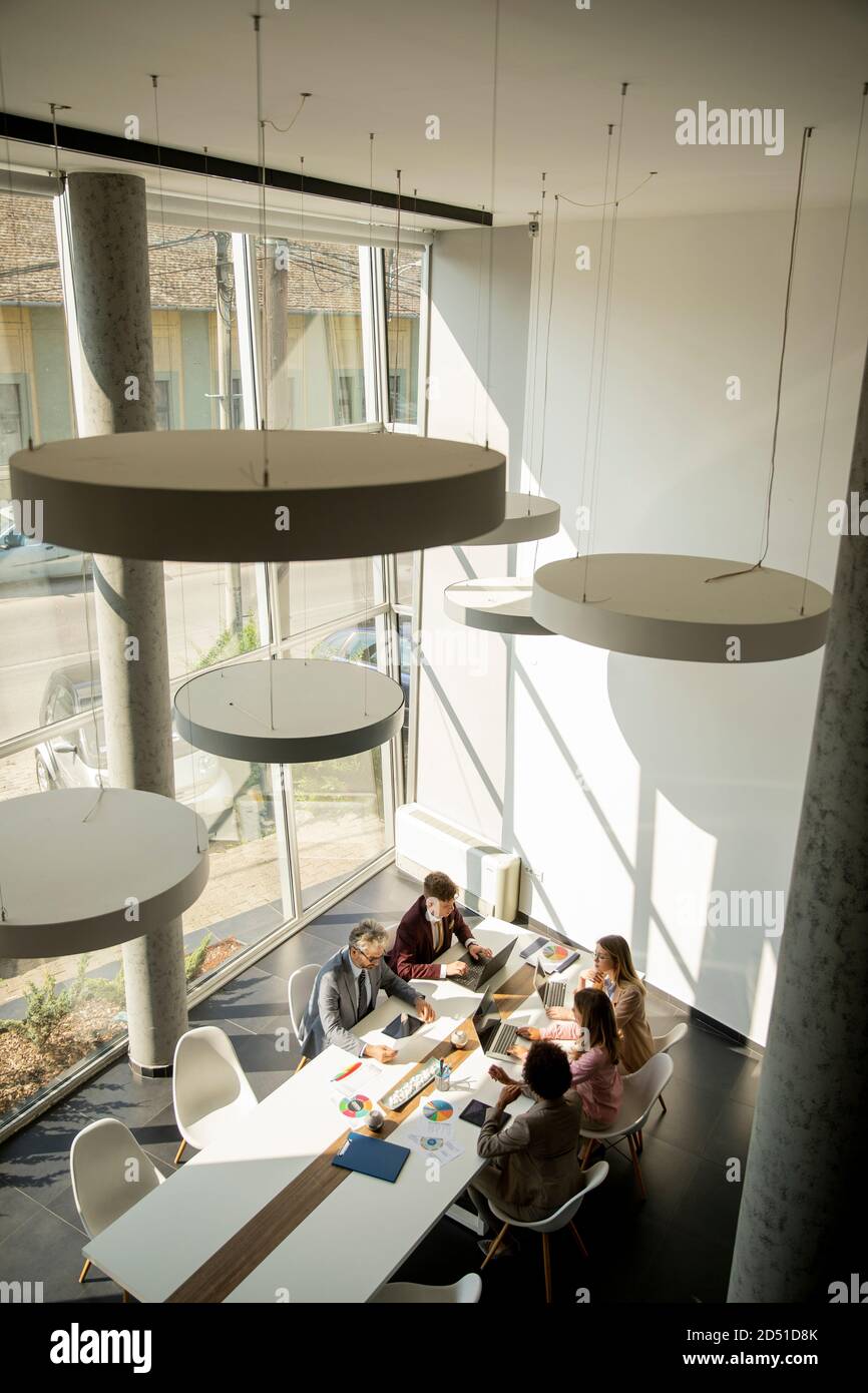 Overhead view at group of multiethnic business people working together ...