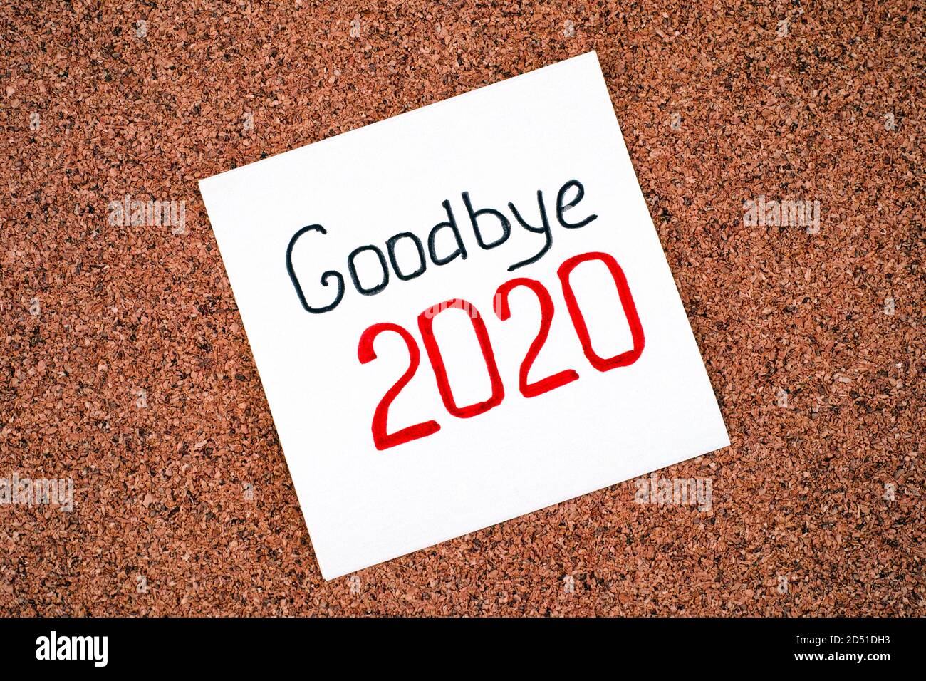 Paper note with words Goodbye 2020 on corkboard background Stock Photo ...
