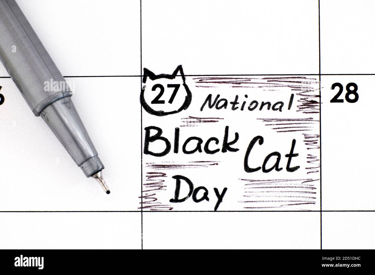 Reminder National Black Cat Day in calendar with pen. October 27 Stock ...