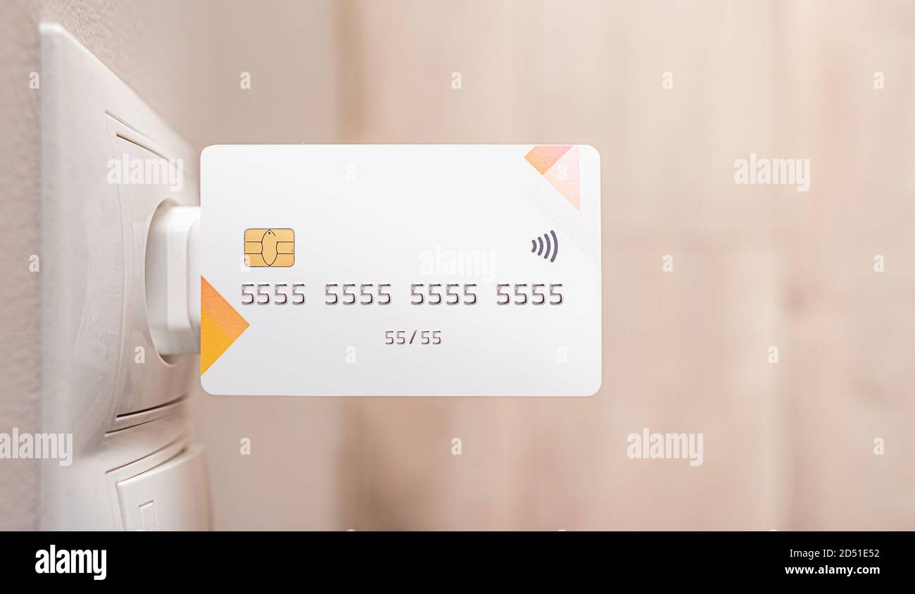 The bank credit card is charged from an electrical outlet Stock Photo ...