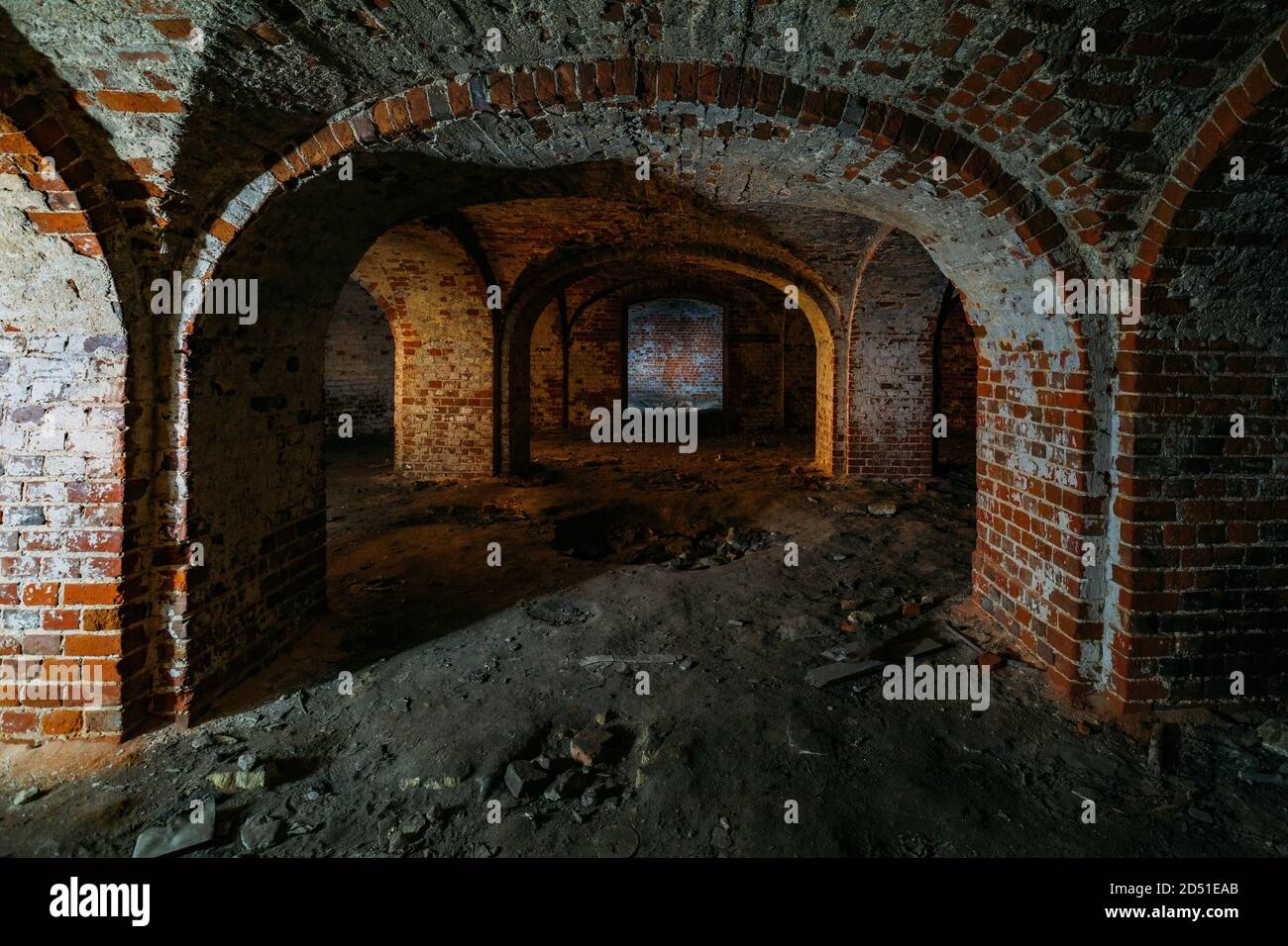 Dark and creepy vaulted red brick dungeon Stock Photo - Alamy