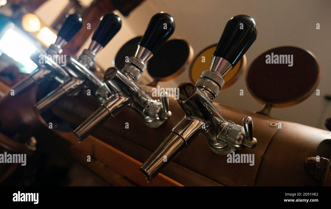 The beer taps in a pub. Nobody. Alcohol concept. Vintage style. Beer ...