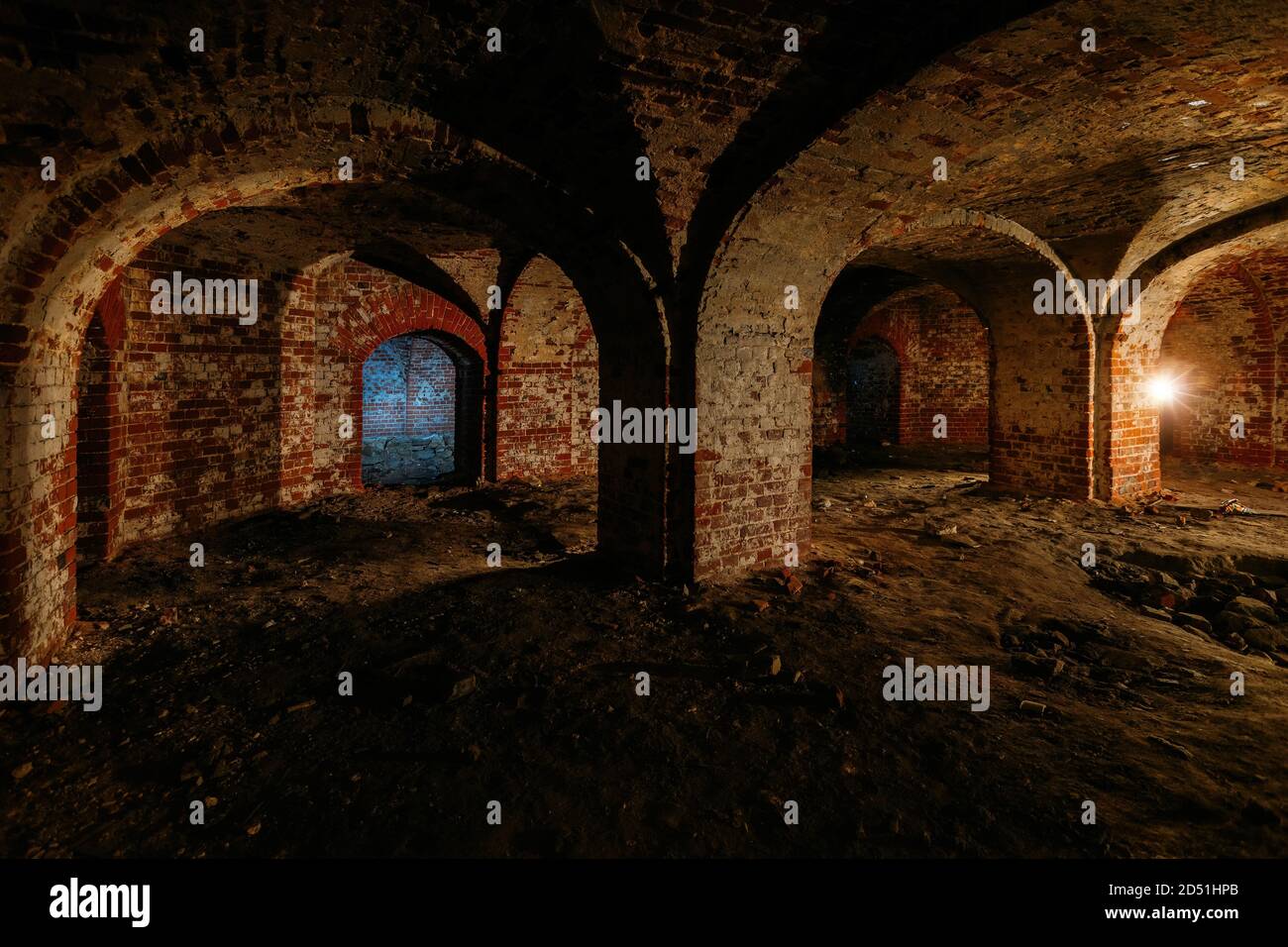 Dark and creepy vaulted red brick dungeon Stock Photo - Alamy