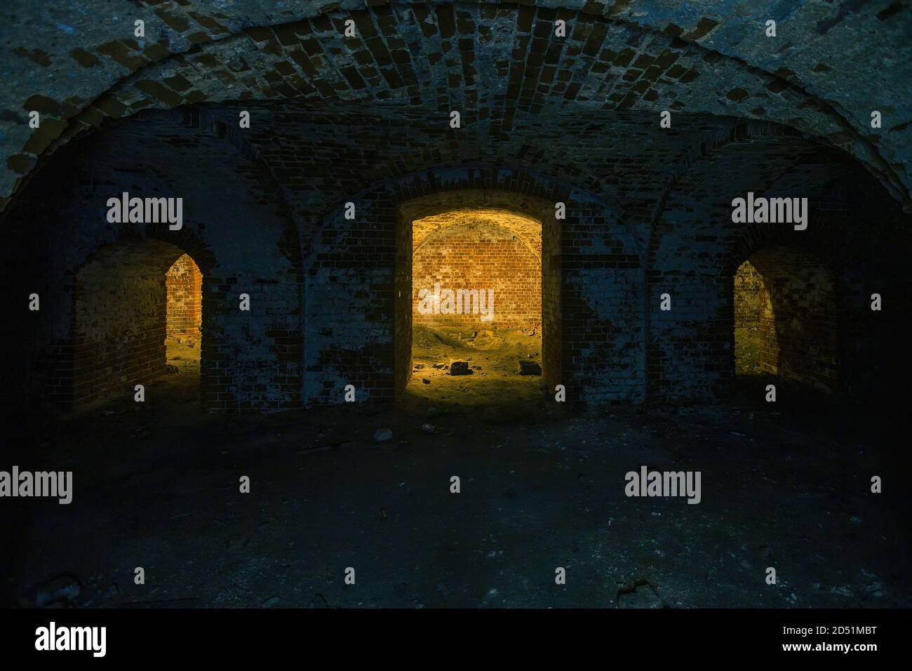 Dark and creepy vaulted red brick dungeon Stock Photo - Alamy