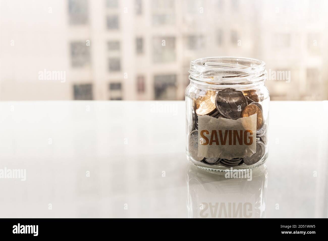 save money, coins in glass jar for money saving financial concept Stock ...