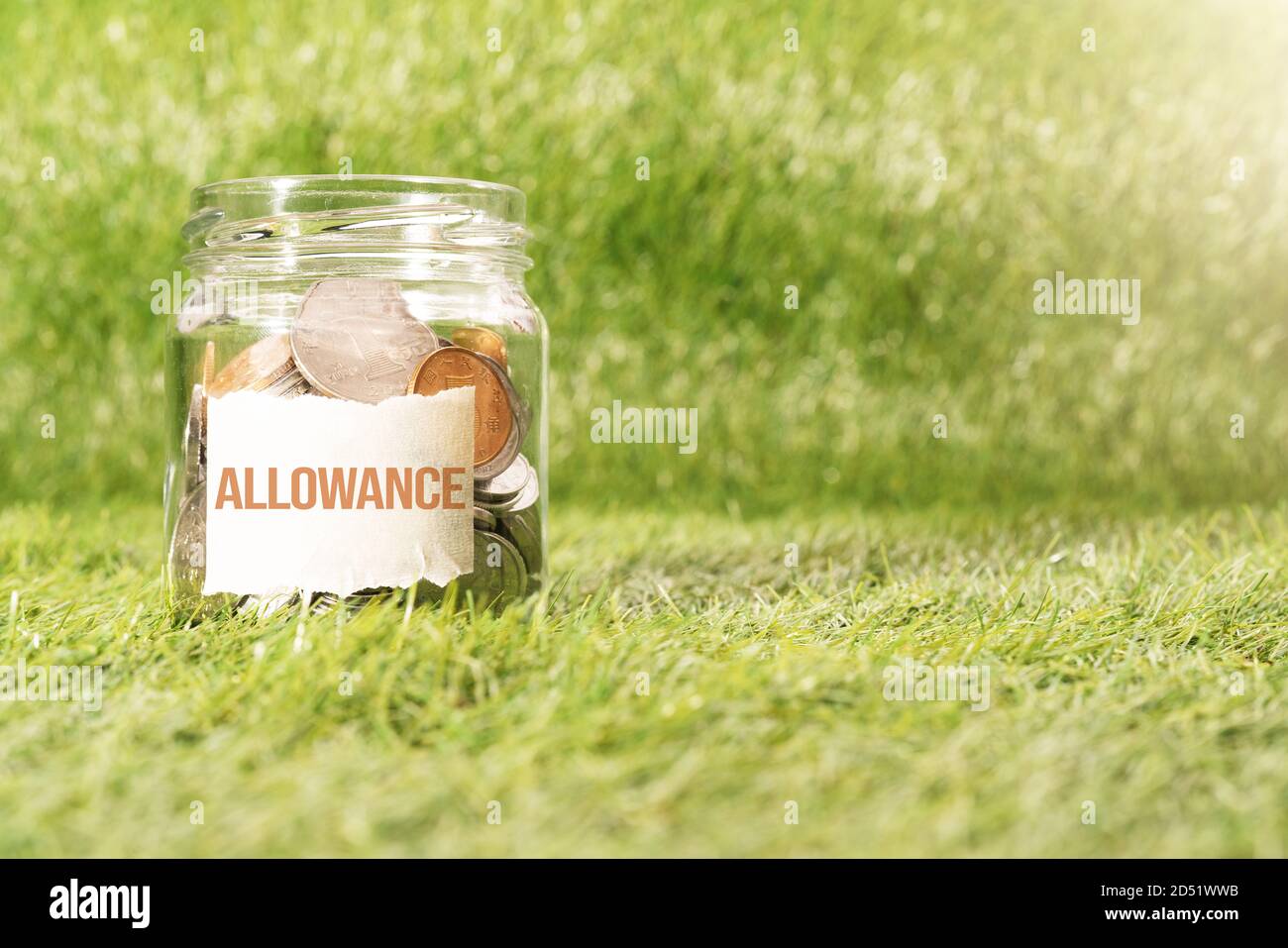 allowance money, coins in glass jar for money saving financial concept ...