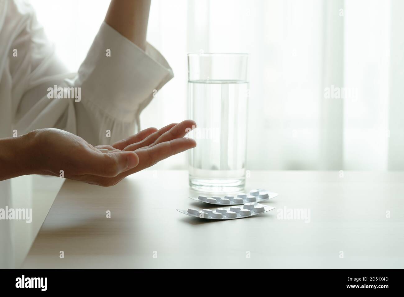 depressed women hand hold medicine with a glass of water, healthcare ...