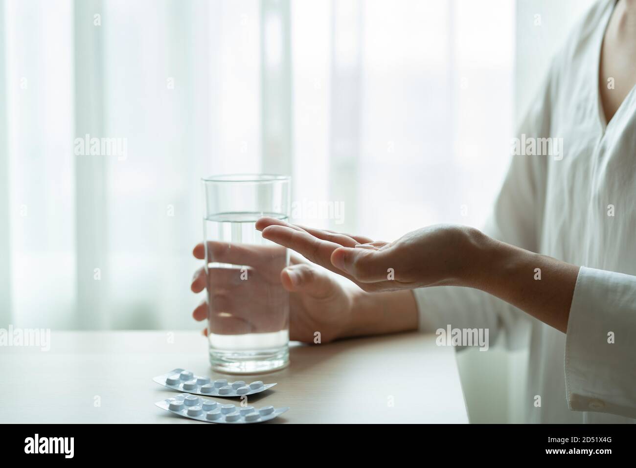 depressed women hand hold medicine with a glass of water, healthcare ...