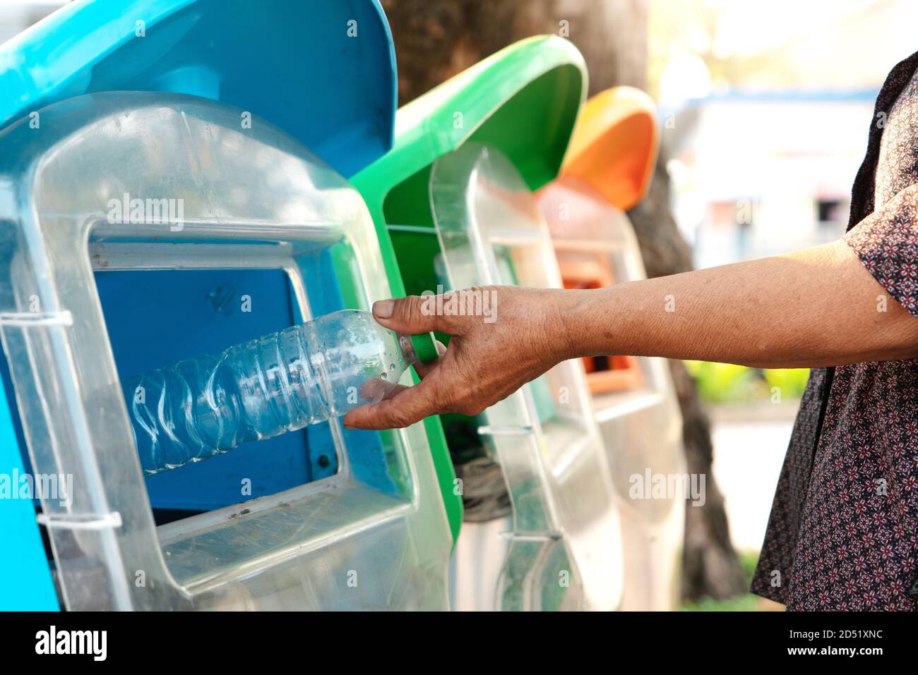 old women hand throwing away the garbage to the bin/trash, sorting ...