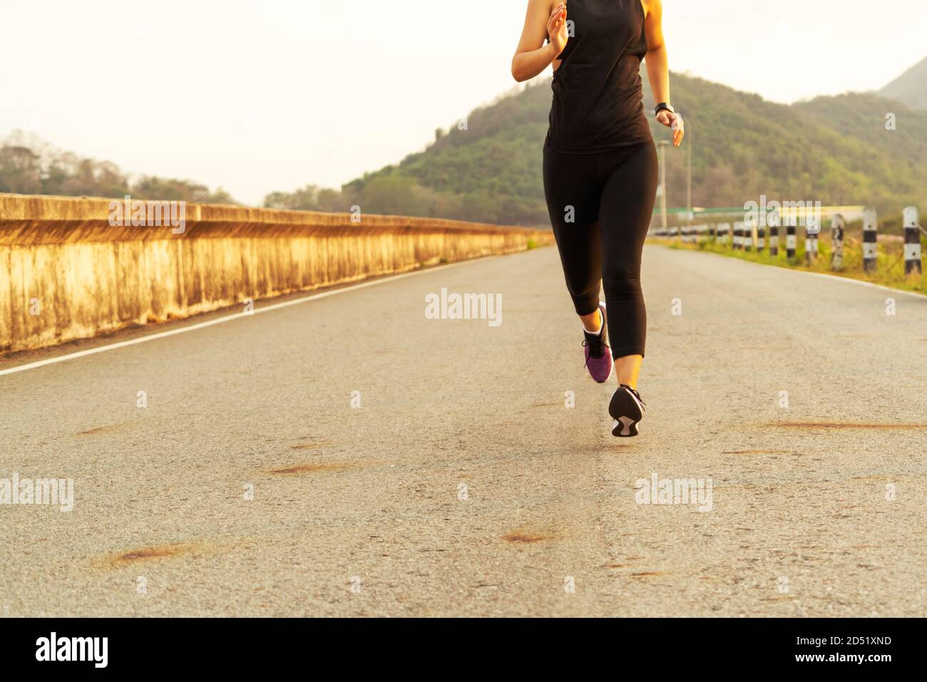sport woman running on a road. Fitness woman training at sunset Stock ...