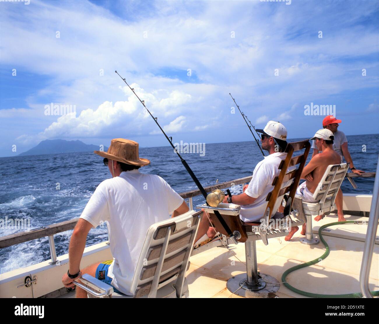 Group of men fishing off mahe seychelles hi-res stock photography and ...