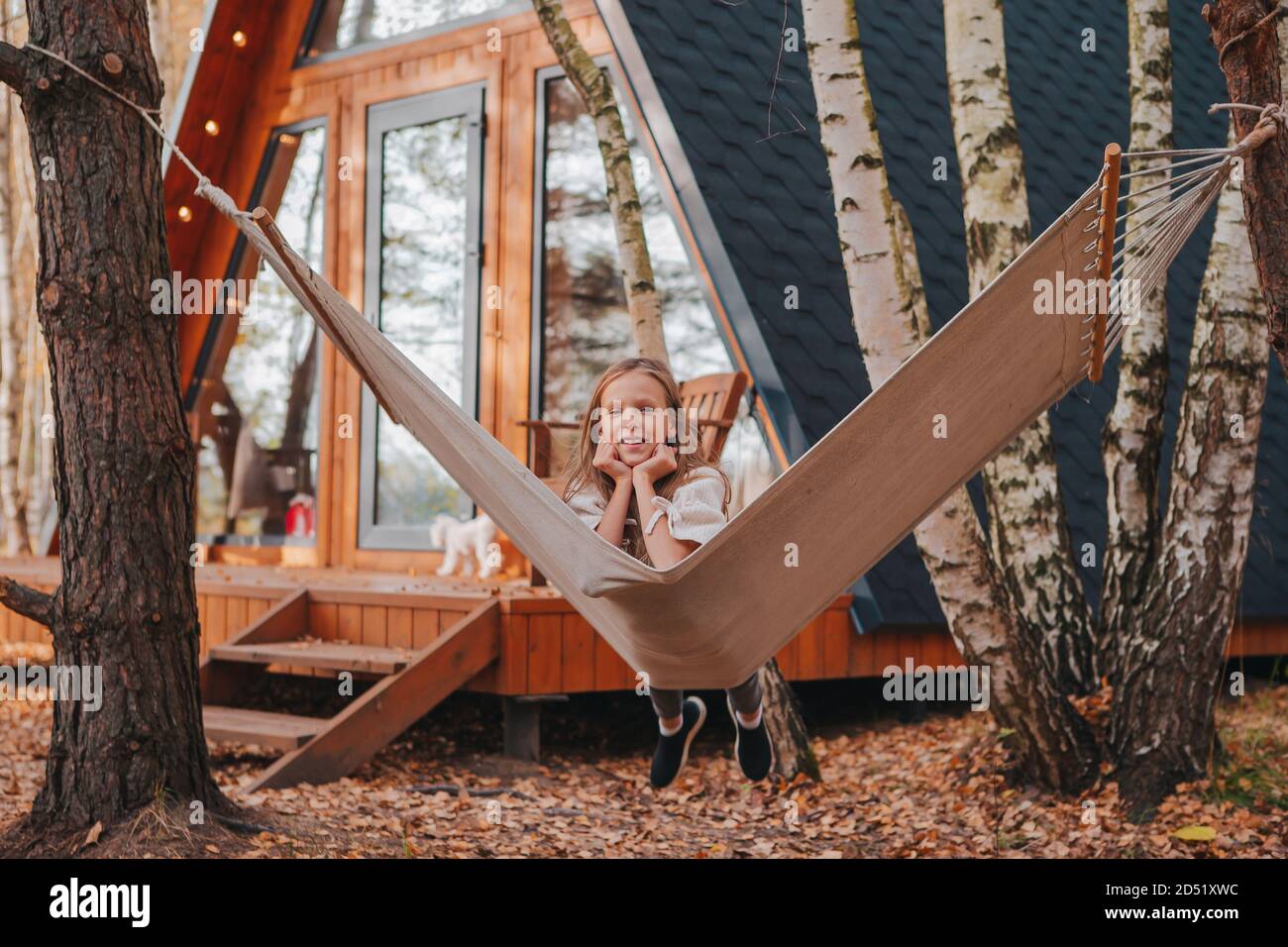 Cheerful girl relaxing in hammock hi-res stock photography and images ...