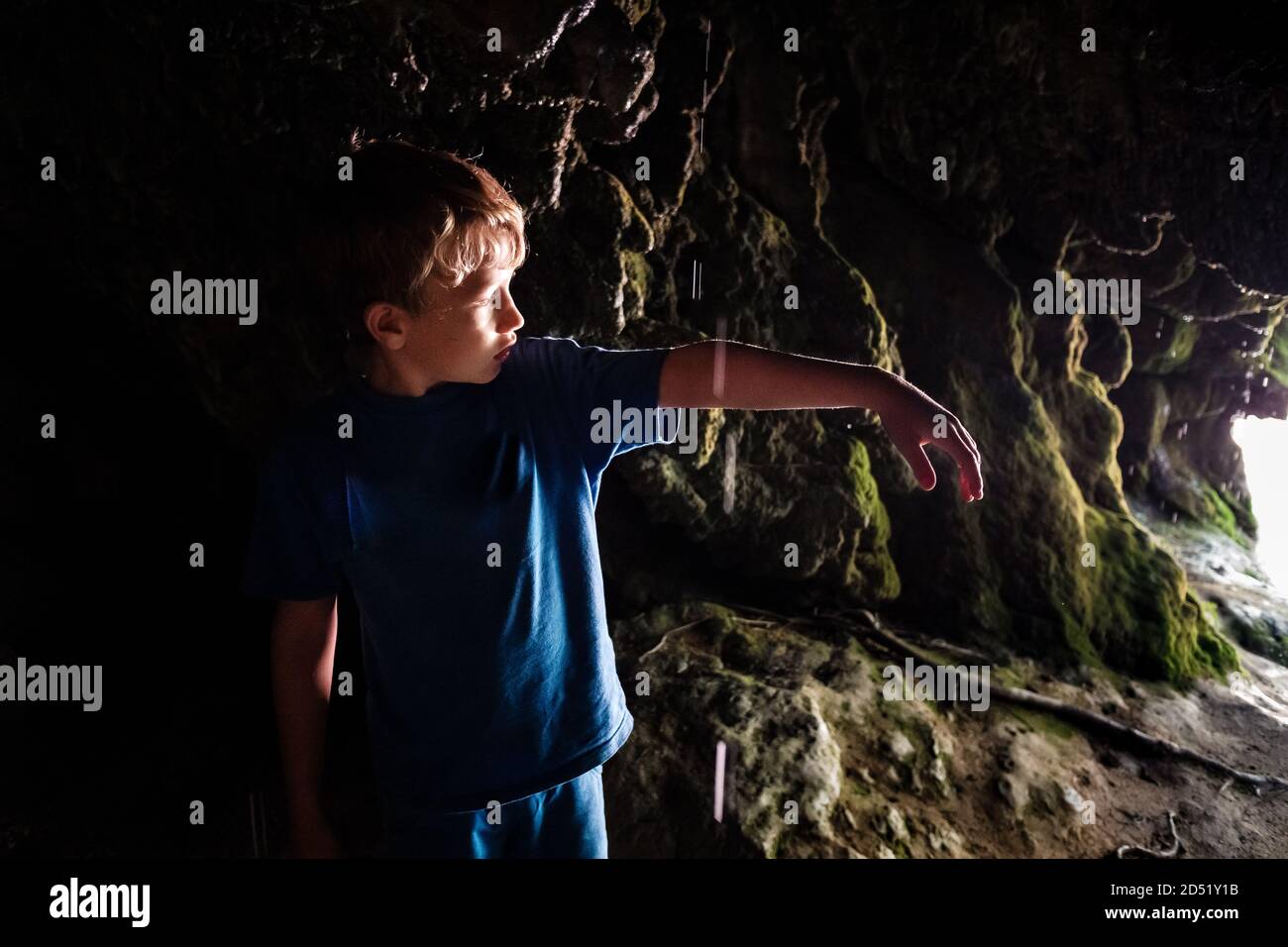 Children explore cave hi-res stock photography and images - Alamy