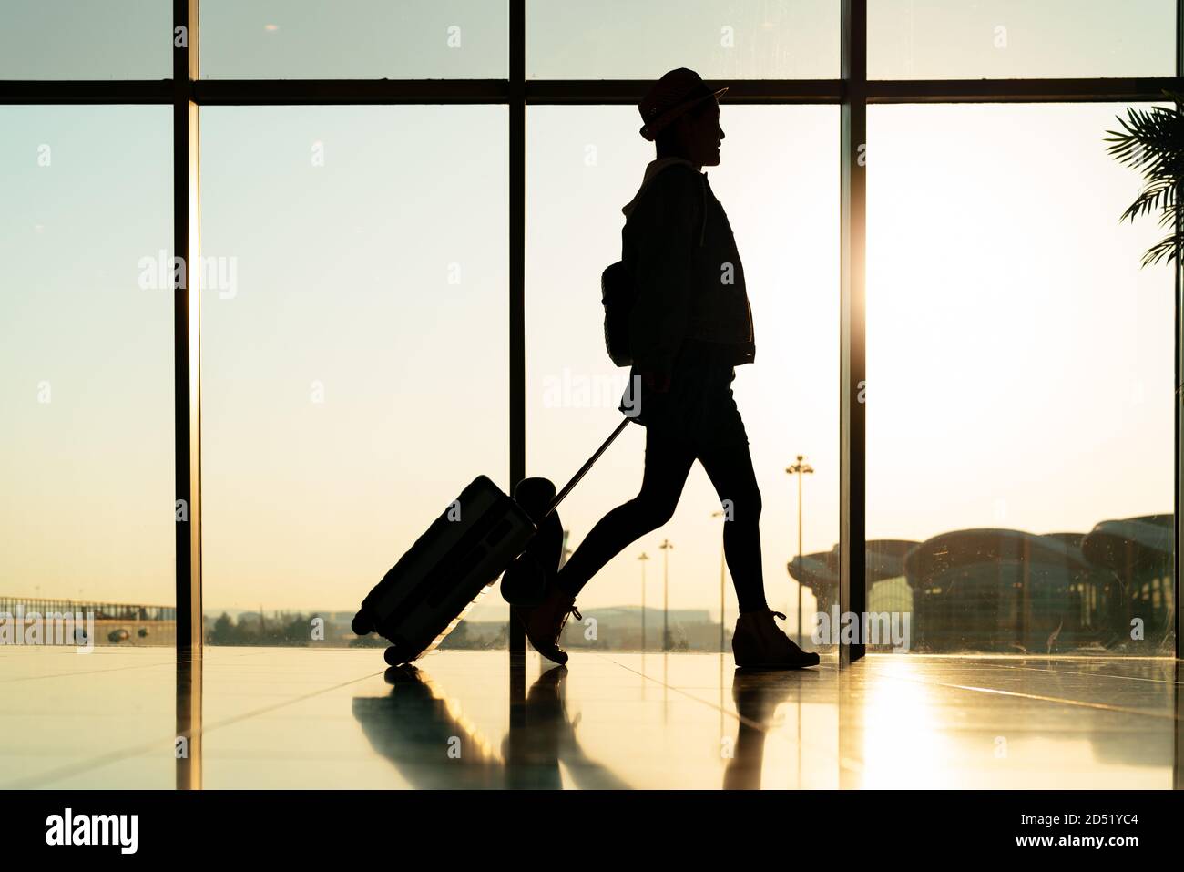 walking traveler with suitcase, passenger for tour in the airport ...