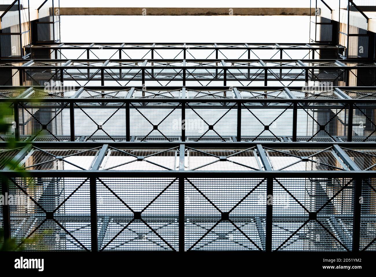 Metal mesh on steel walkways between buildings to communicate Stock ...