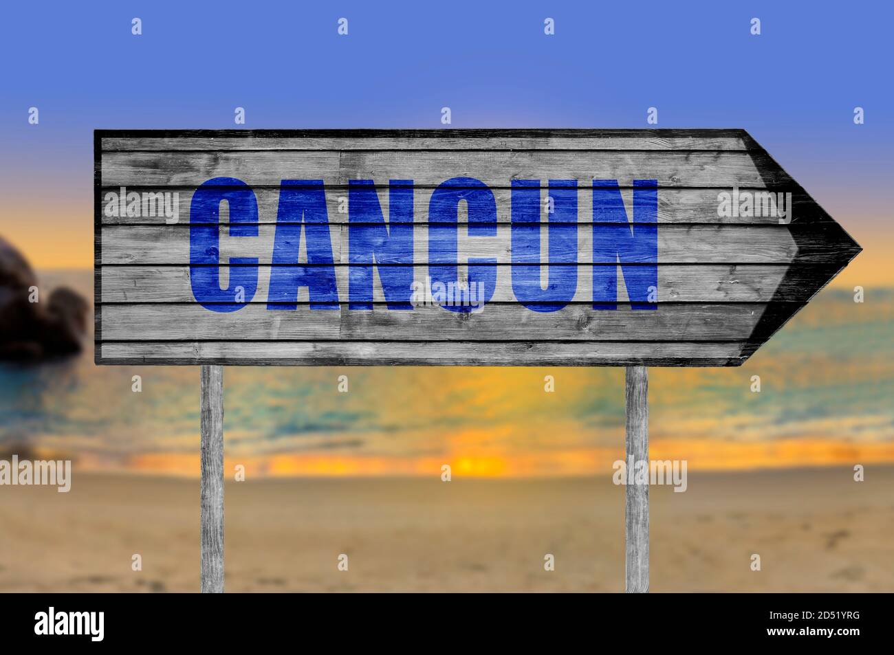 Cancun wooden sign with beach background Stock Photo - Alamy