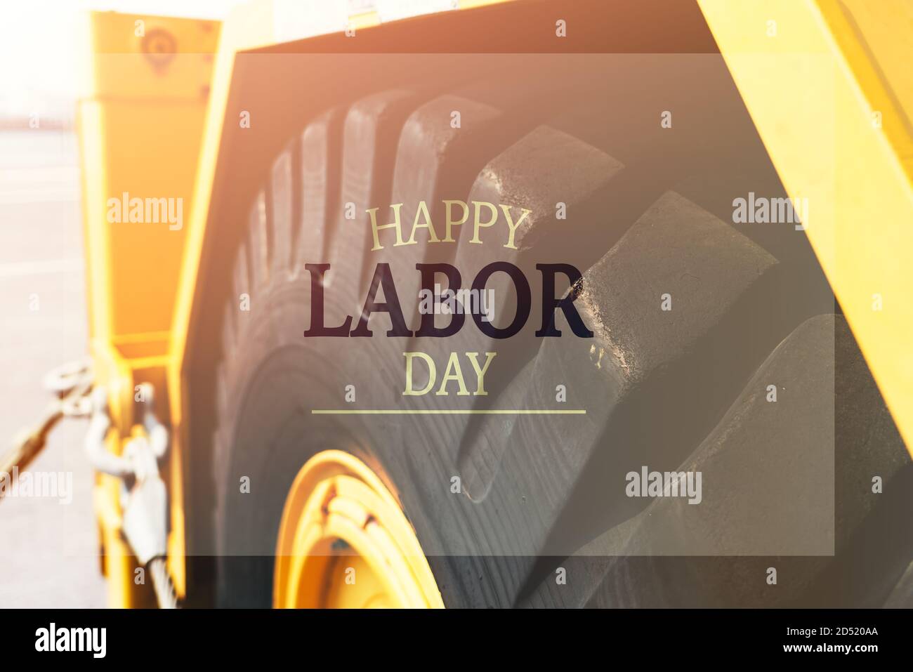 Labor Day Concept. excavator wheel closeup with word Happy Labor Day ...