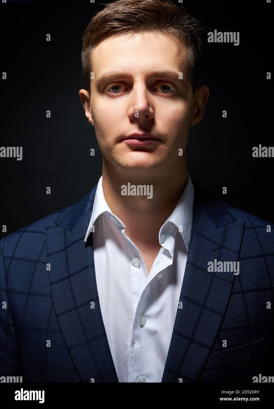 portrait of serious handsome male in trendy classic suit, isolated on ...