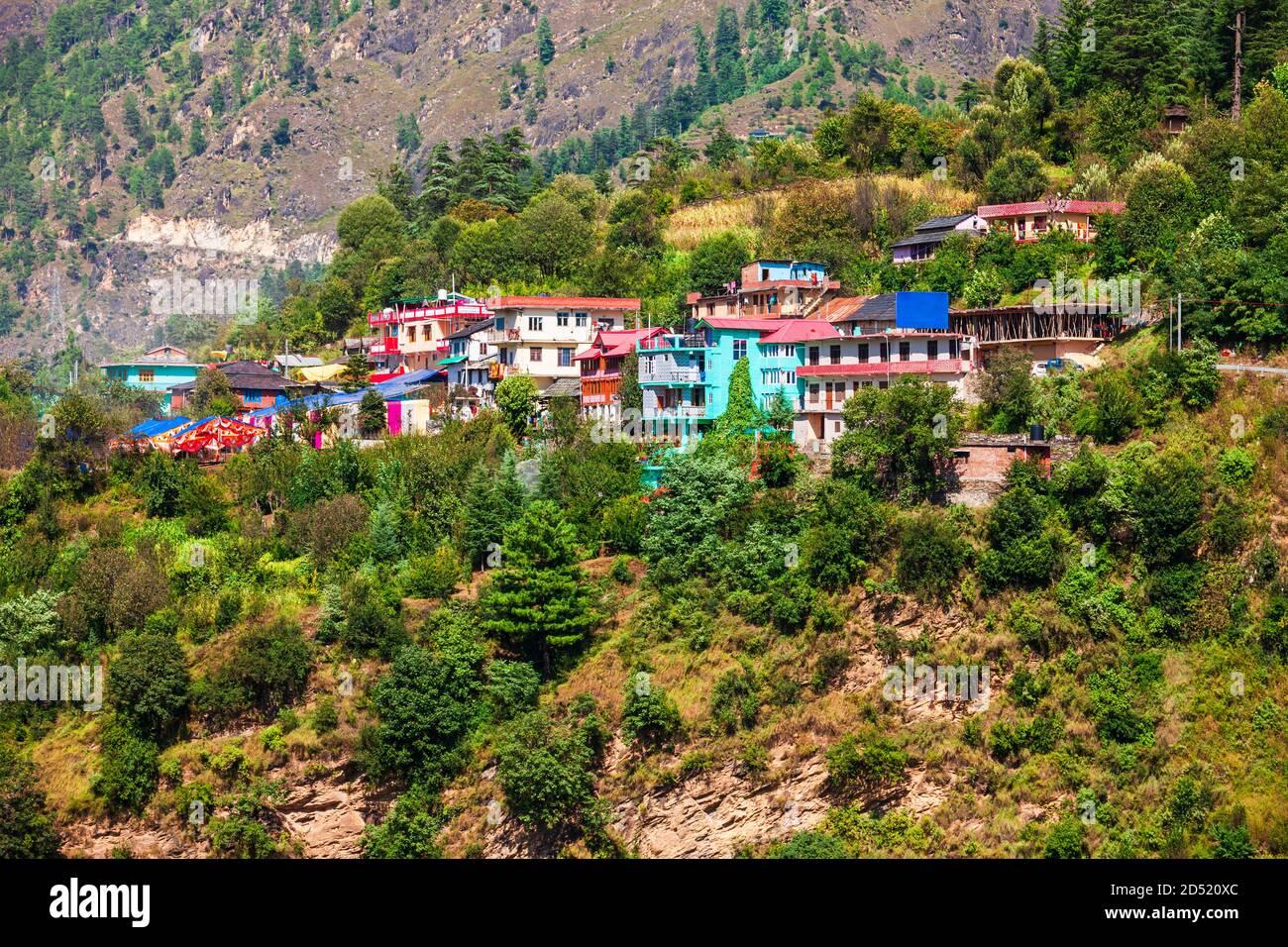 Scenic landscape of the local houses and forested Himalaya mountains in ...