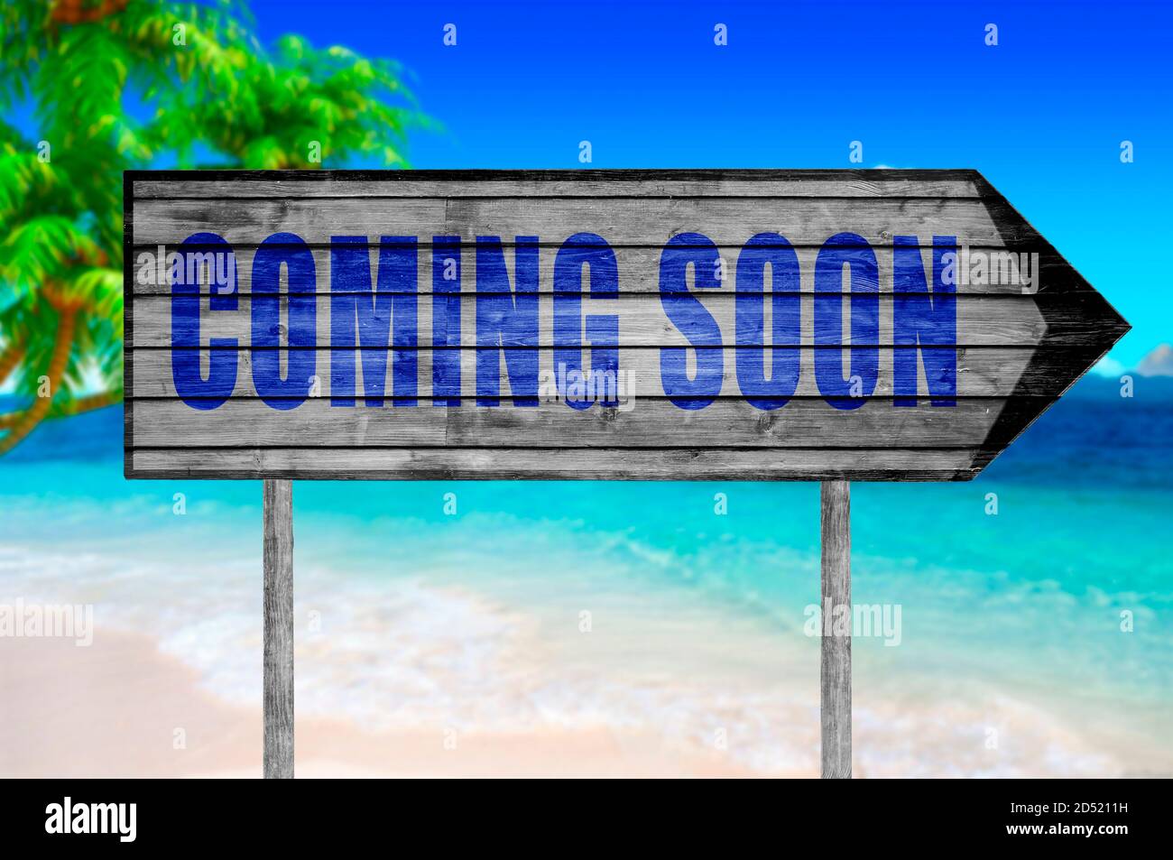 Coming Soon wooden sign with on a beach background Stock Photo - Alamy