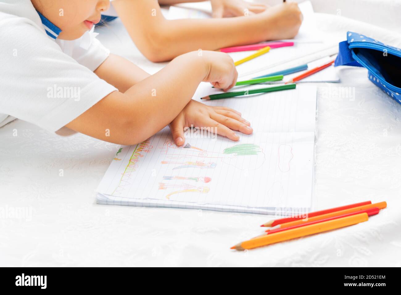 two sister girl writes to writing-books. The decision of lessons. girl ...