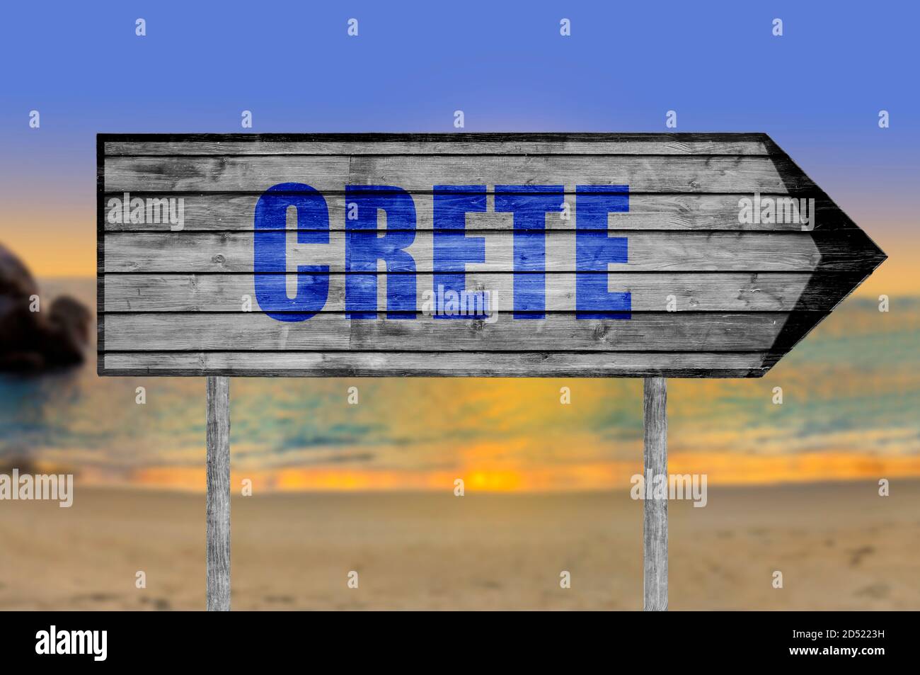 Crete wooden sign with beach background Stock Photo - Alamy