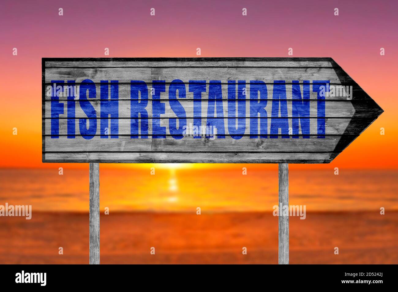 Fish Restaurant wooden sign with on a beach background Stock Photo - Alamy
