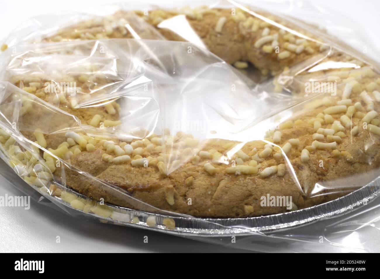 Sweet bisulan donut with traditional hole and sugar in plastic folding ...