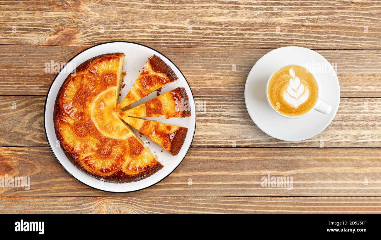Homemade Pineapple Upside Down Cake and cup of coffee cappuccino on ...