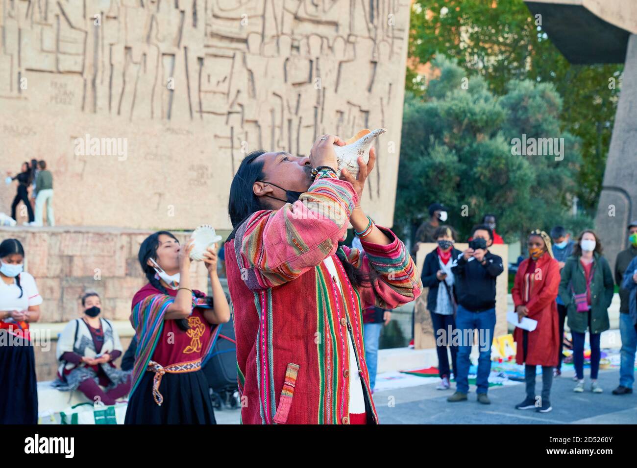 Blowing into and using a conch shell in ceremony Plaza Colon, Dia ...