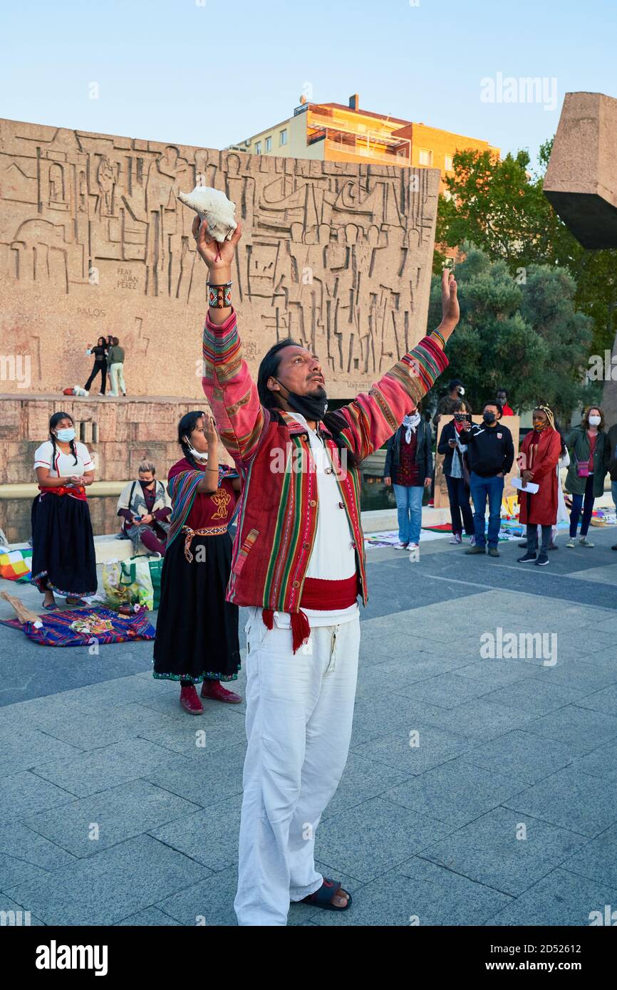 Blowing into and using a conch shell in ceremony Plaza Colon, Dia ...