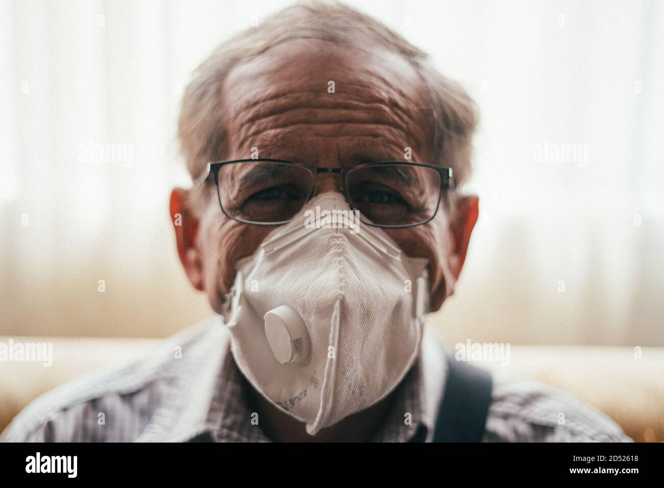 Old man working in pandemic quarantine Stock Photo - Alamy