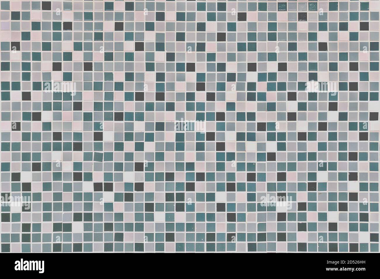 The texture of a small swamp-colored tile on the wall. Mosaic ...