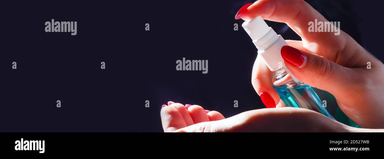 Using antibacterial spray for hands. People, healthcare and hygiene ...