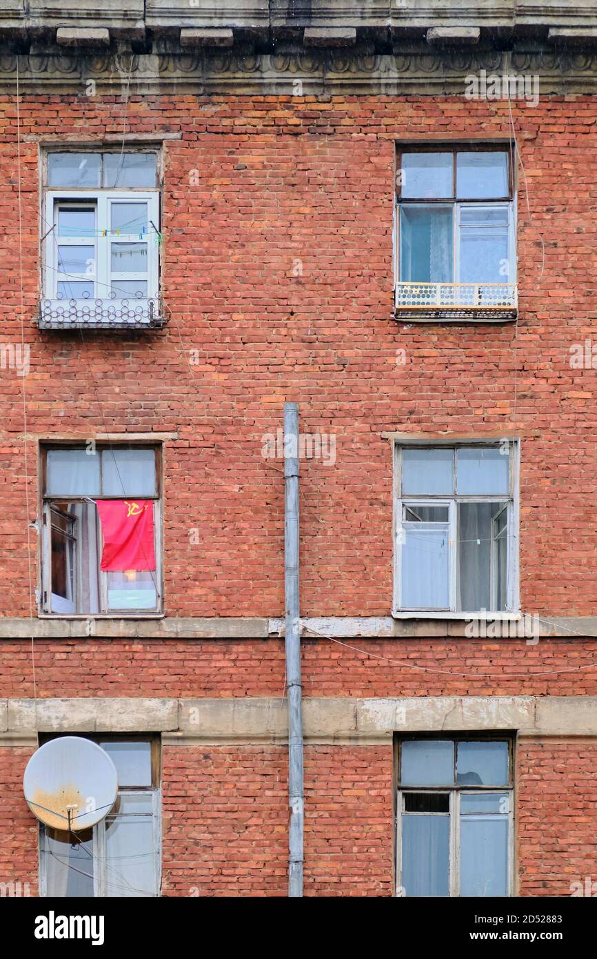 Red USSR flag hung on an old window in Russia, Moscow Stock Photo - Alamy