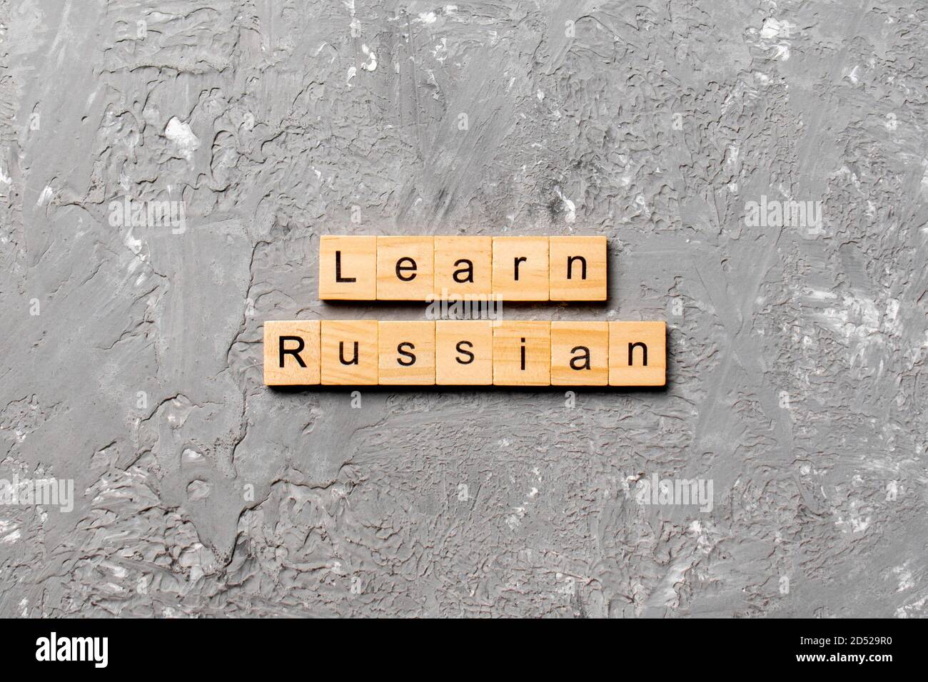 learn russian word written on wood block. learn russian text on table ...