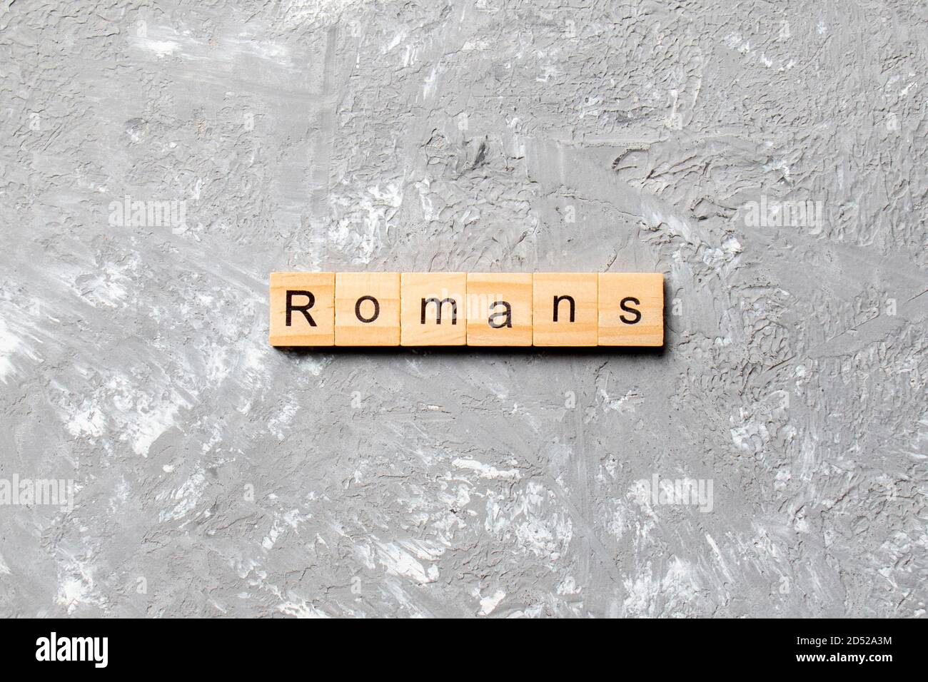 romans word written on wood block. romans text on table, concept Stock ...