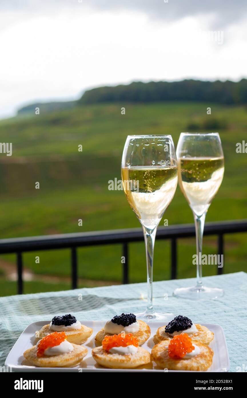 Tasting and pairing of french champagne wine with pancakes, creme fresh ...